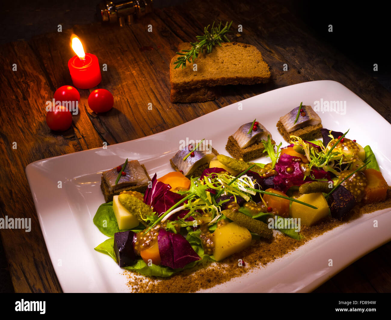 Canape from rye bread with herring slice Stock Photo - Alamy
