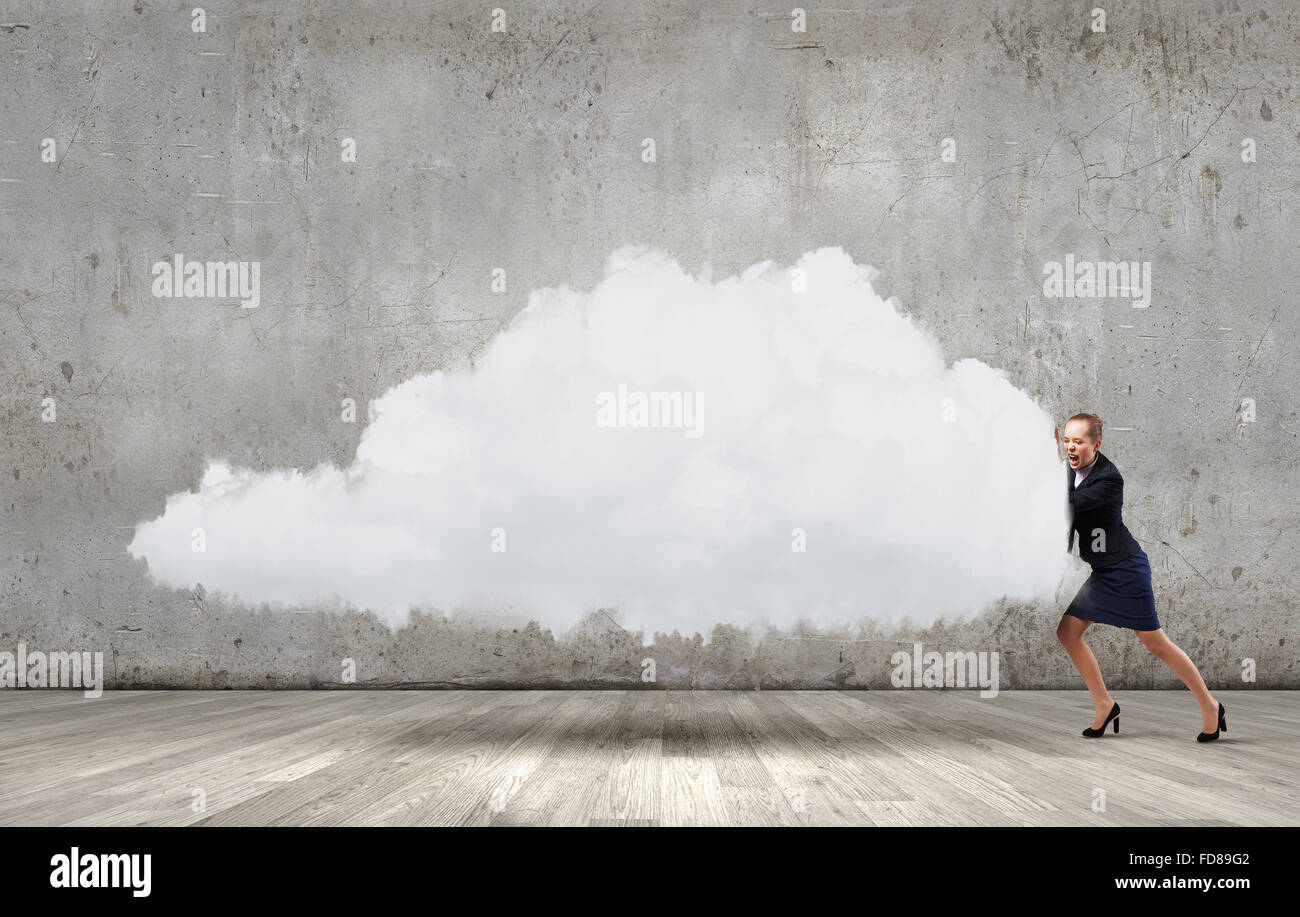 Attractive businesswoman pushing big cloud with effort Stock Photo - Alamy