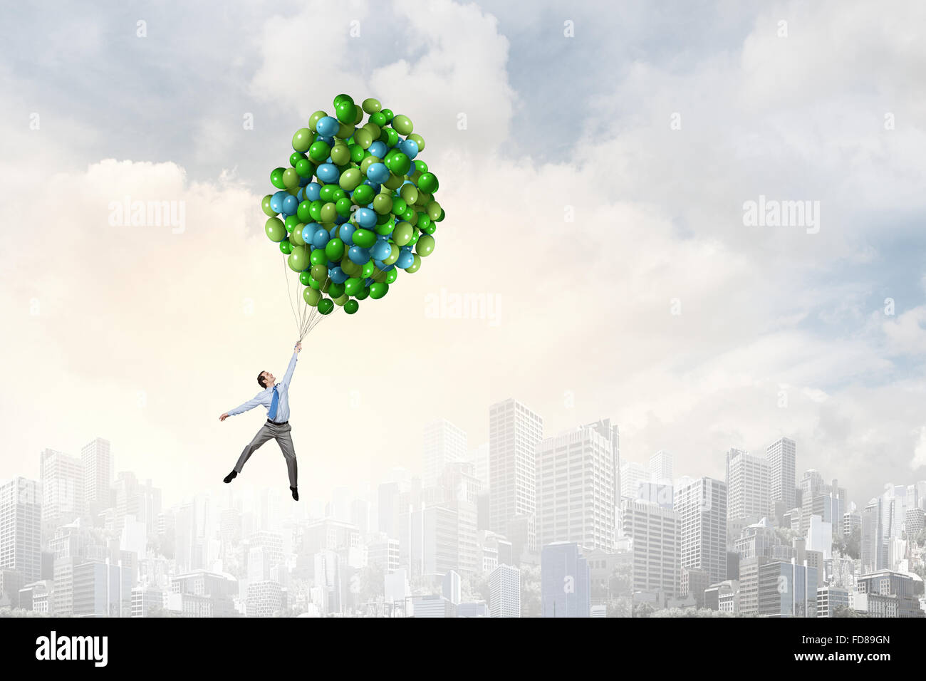 Young successful businessman flies on bunch of colorful balloons Stock ...