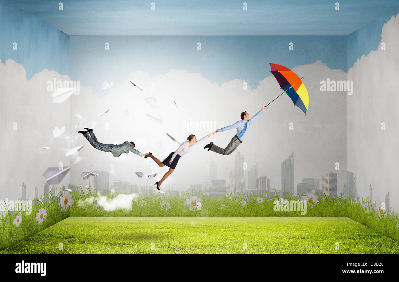 Business people flying in the sky on umbrella Stock Photo - Alamy