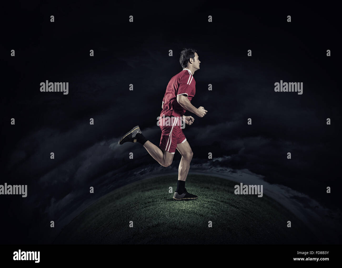 Running man in red sport wear on black background Stock Photo - Alamy