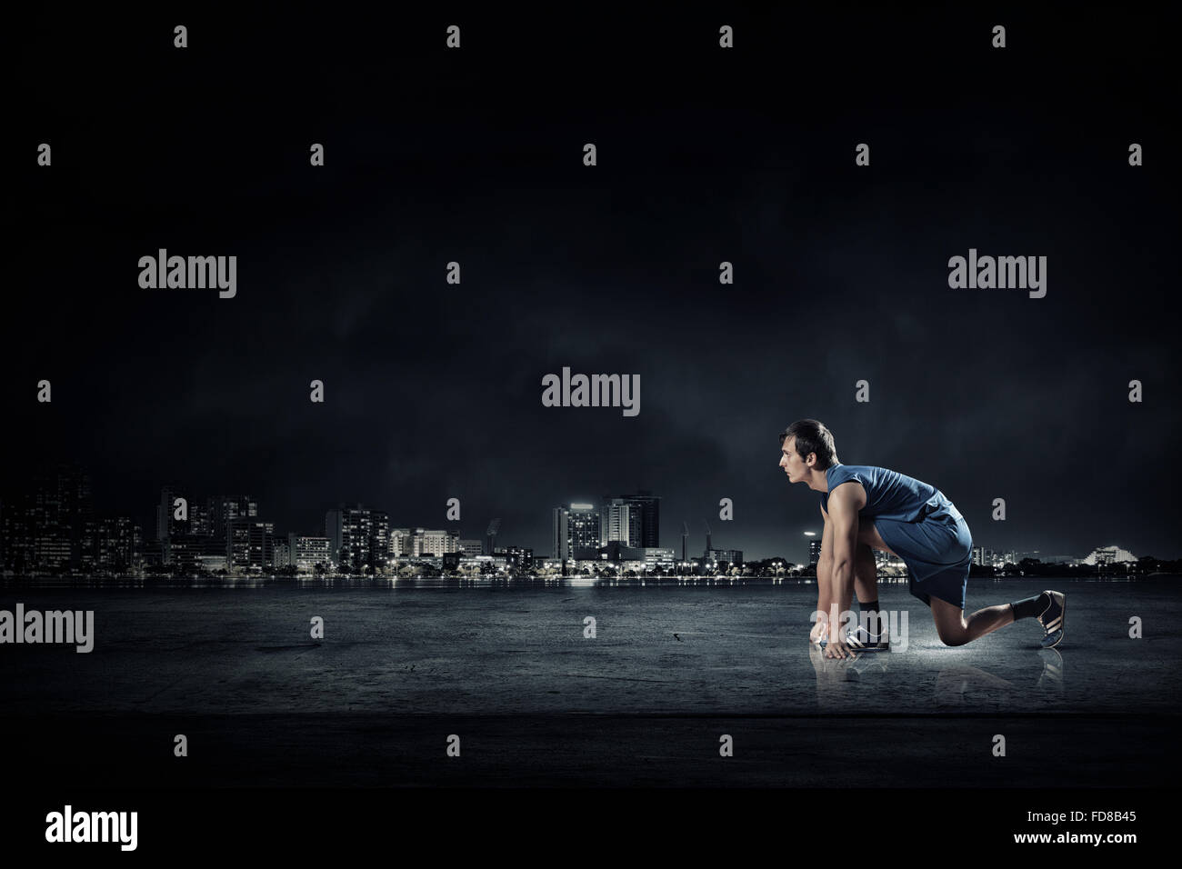 Running man in blue sport wear on black background Stock Photo - Alamy
