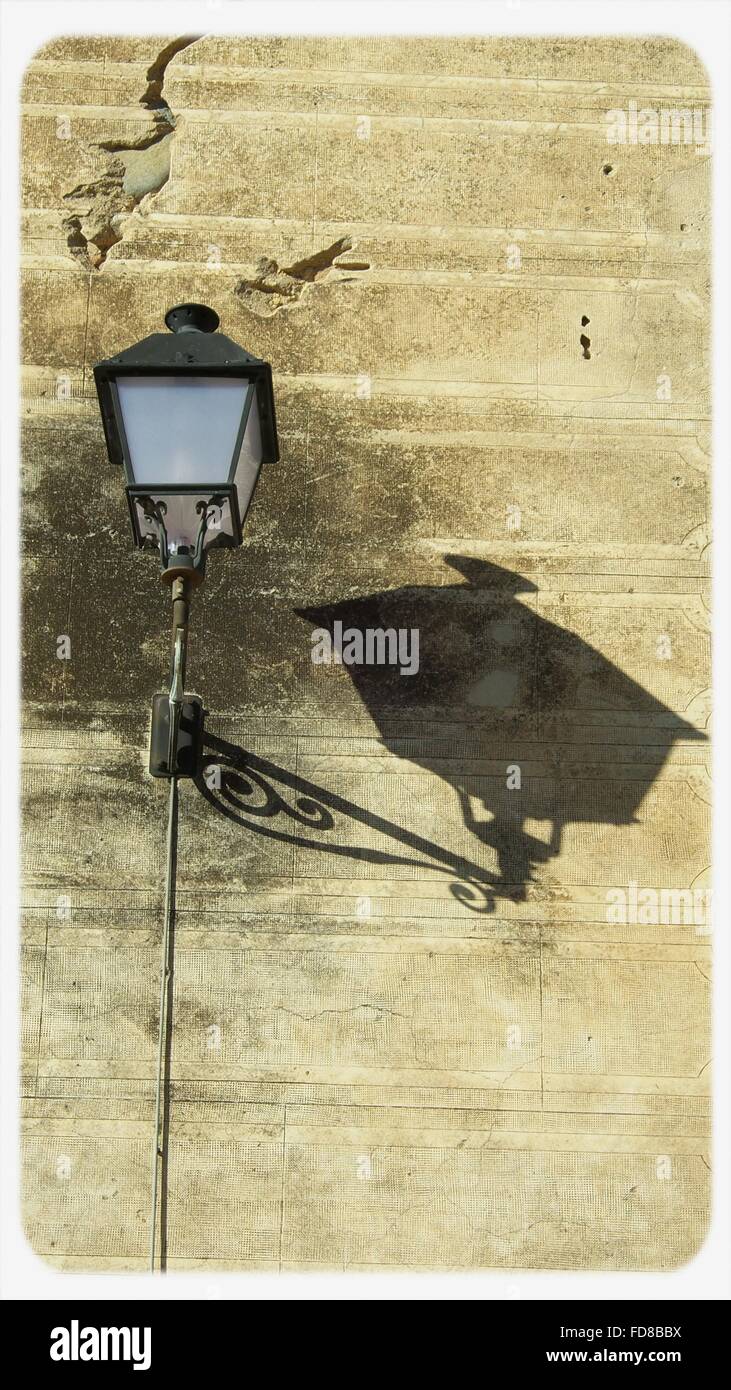 Shadow Of Street Light On Wall Stock Photo - Alamy