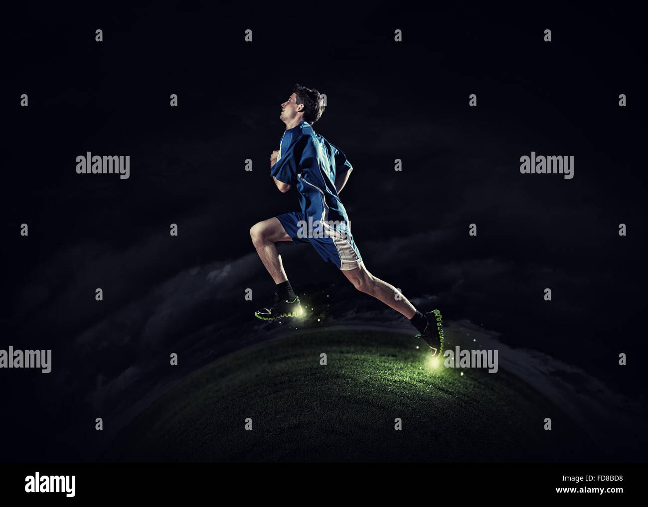 Running man in blue sport wear on black background Stock Photo - Alamy