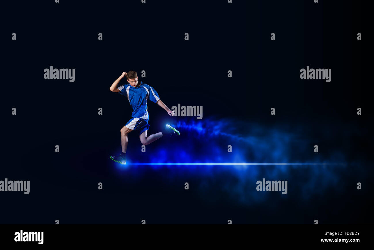 Running man in blue sport wear on black background Stock Photo - Alamy