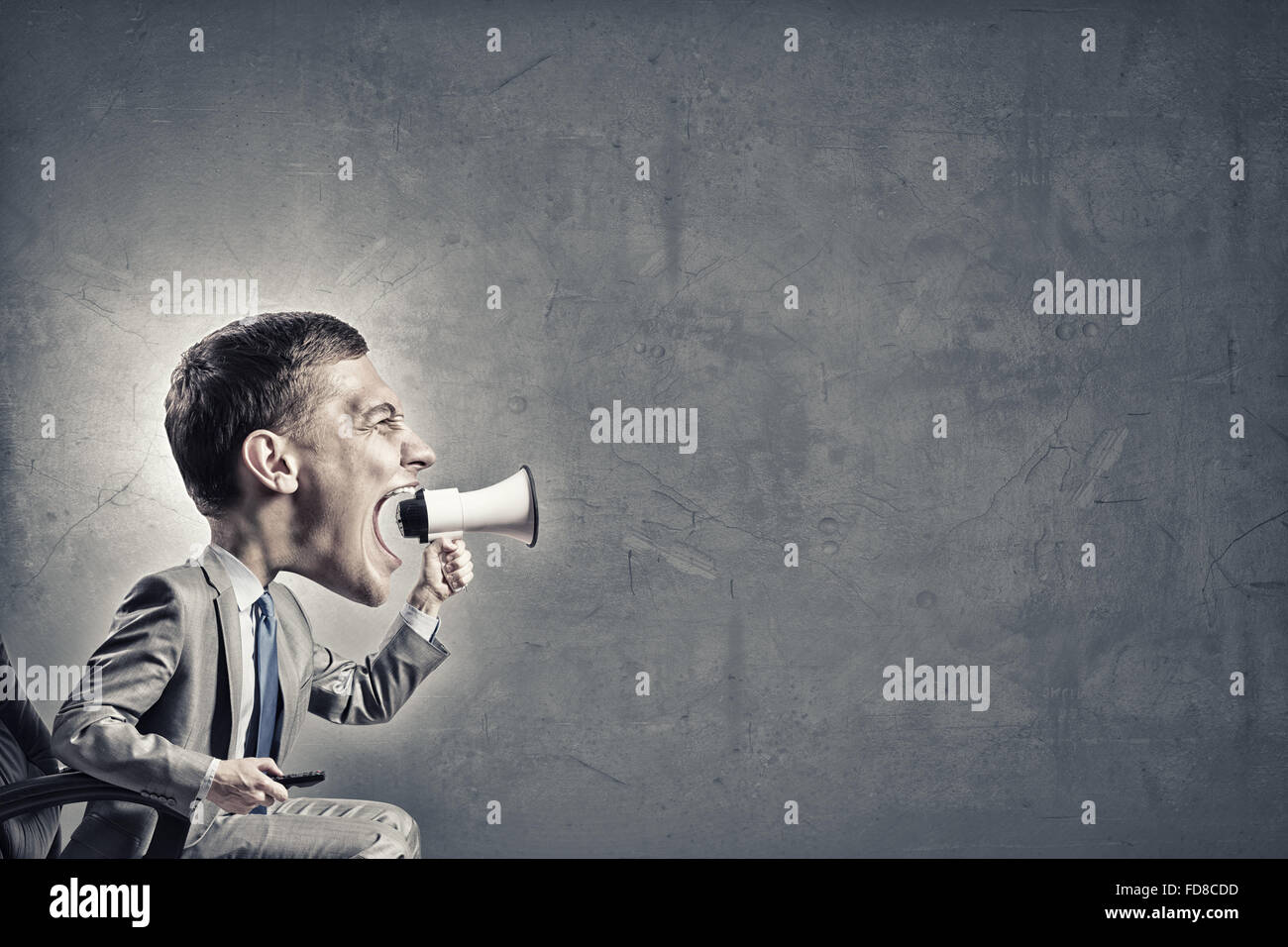 Funny young man with big head screaming emotionally in megaphone Stock ...