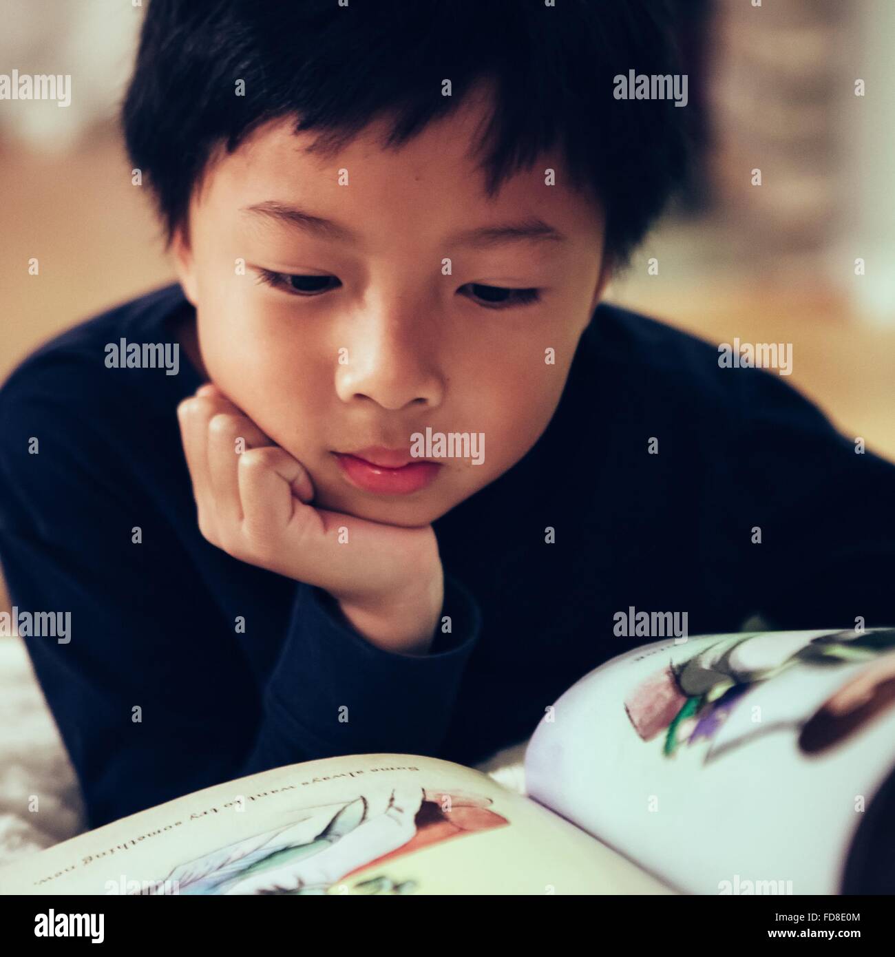 Boys reading book hi-res stock photography and images - Alamy