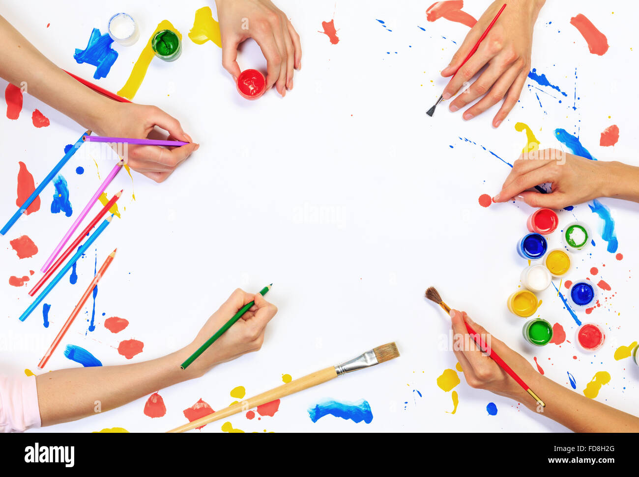 Close up of a human hands painting with gouache on white paper Stock ...