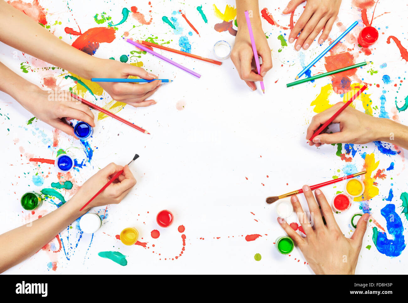 Close up of a human hands painting with gouache on white paper Stock ...