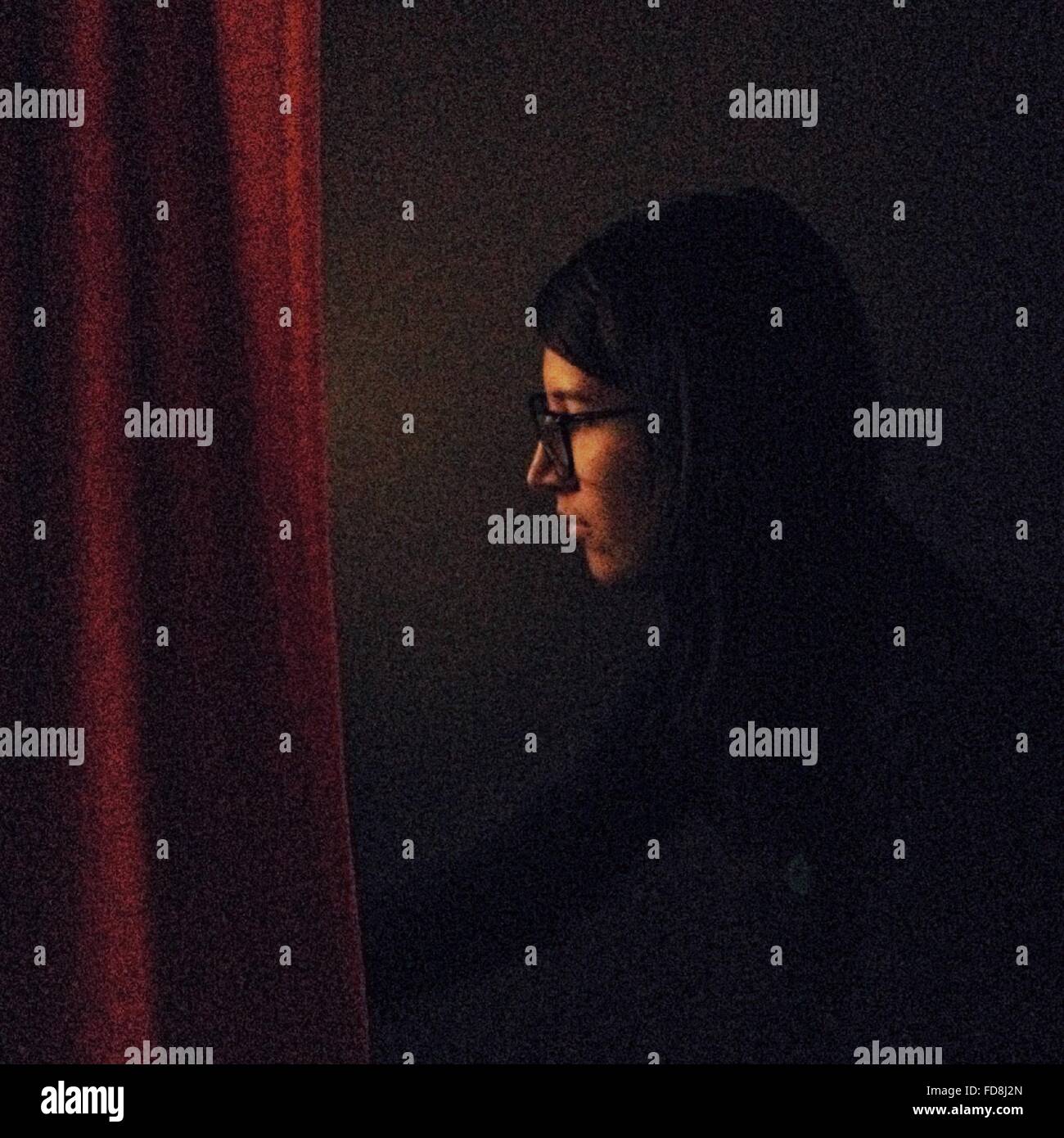 Side View Of Woman Standing Against Wall Stock Photo - Alamy