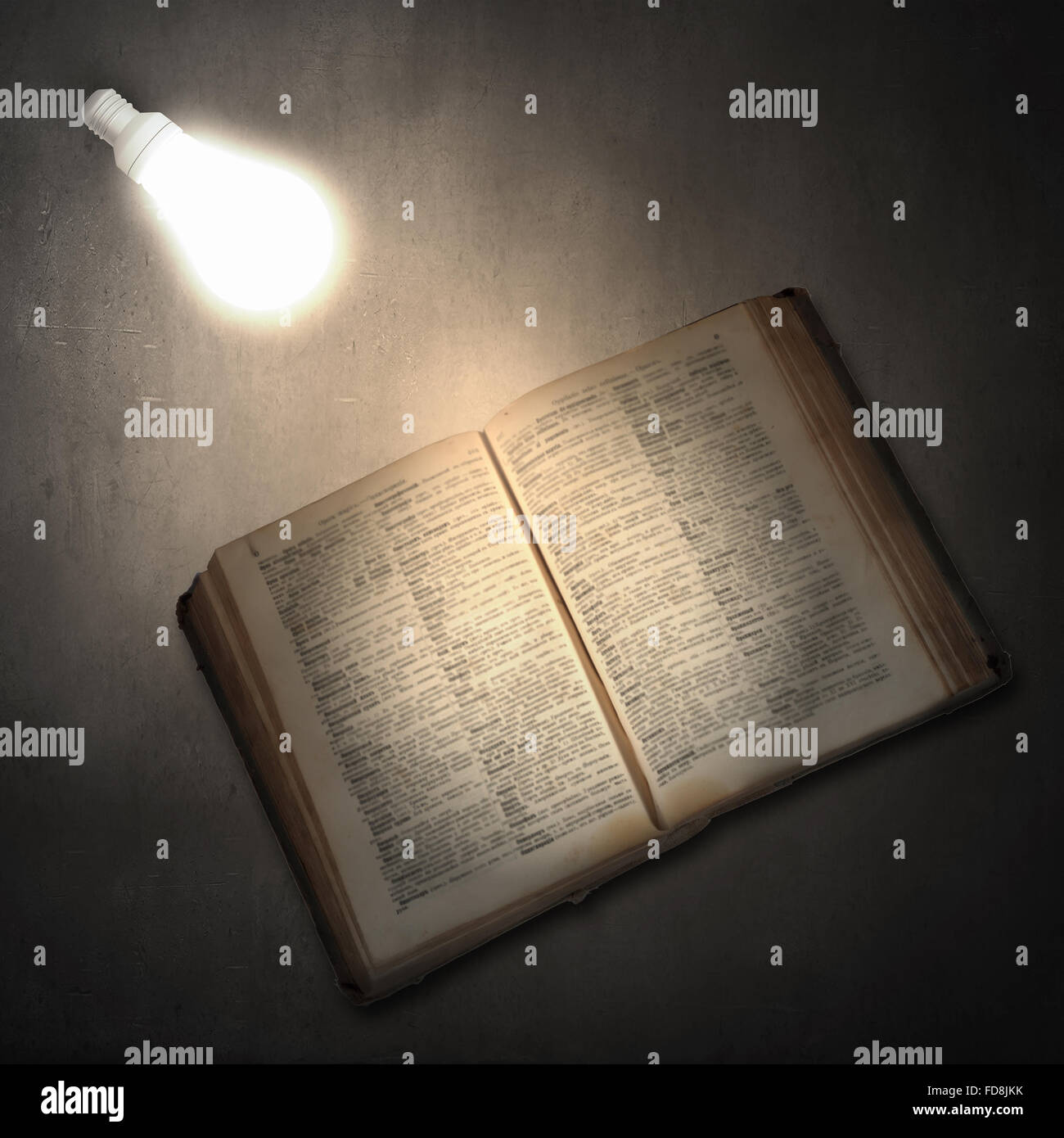 Light bulb over open book hi-res stock photography and images - Alamy