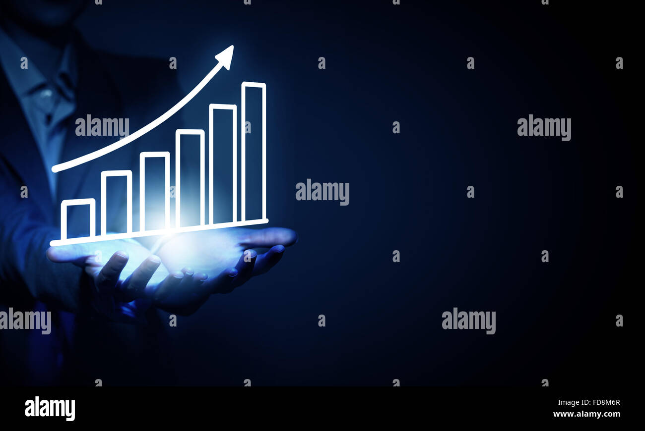 Human hand presenting on palm growing income chart Stock Photo - Alamy