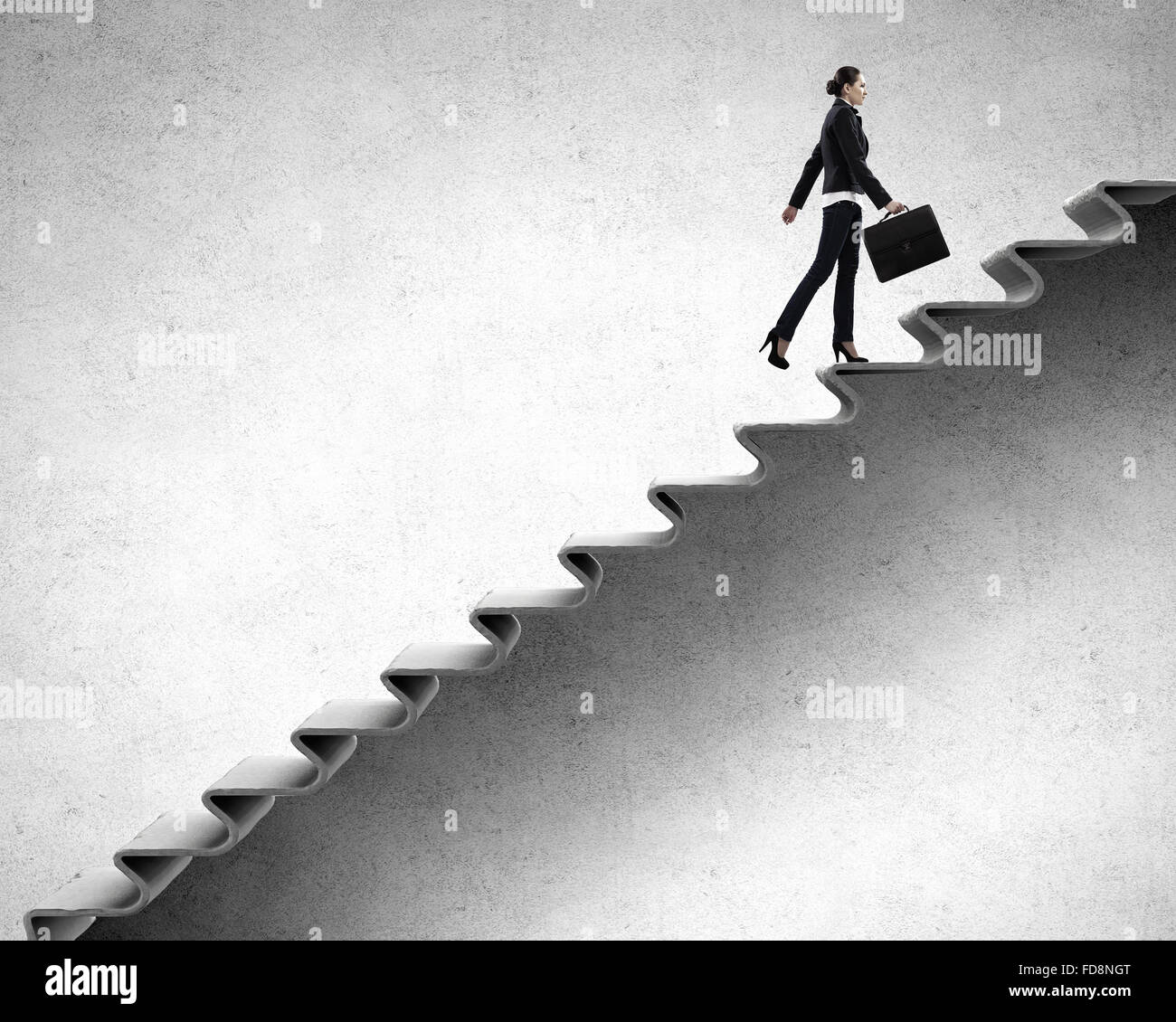 Young businesswoman walking up on staircase representing success ...