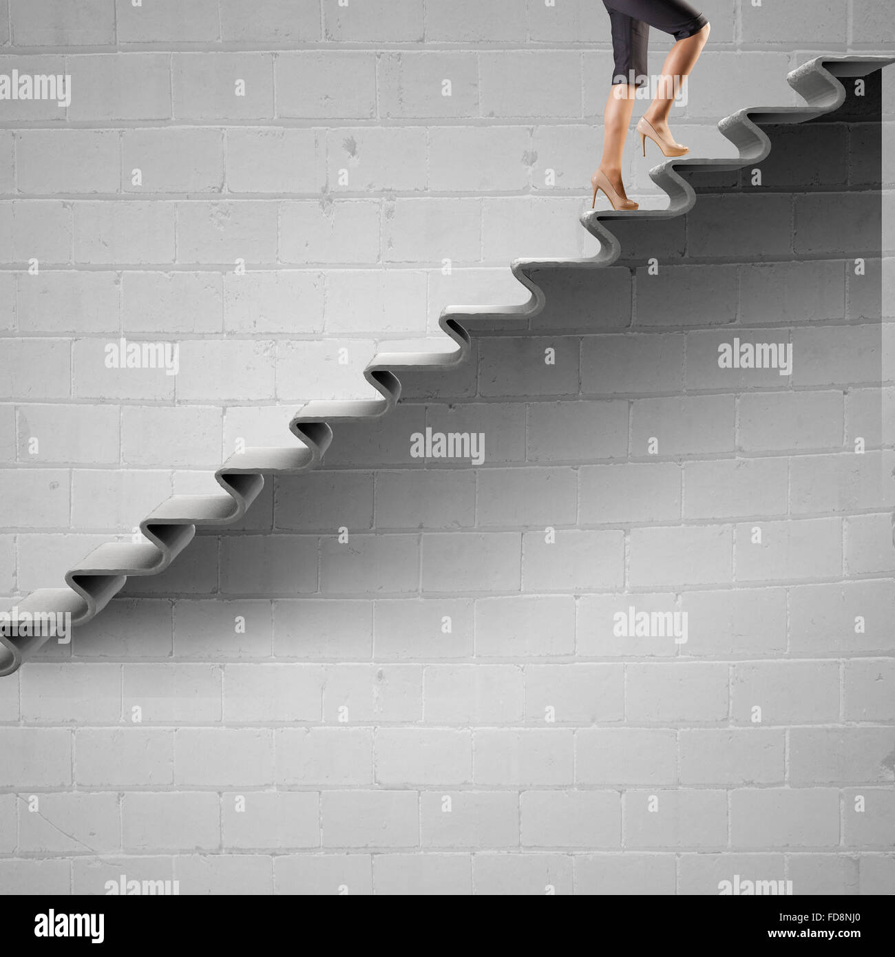 Young businesswoman walking up on staircase representing success ...