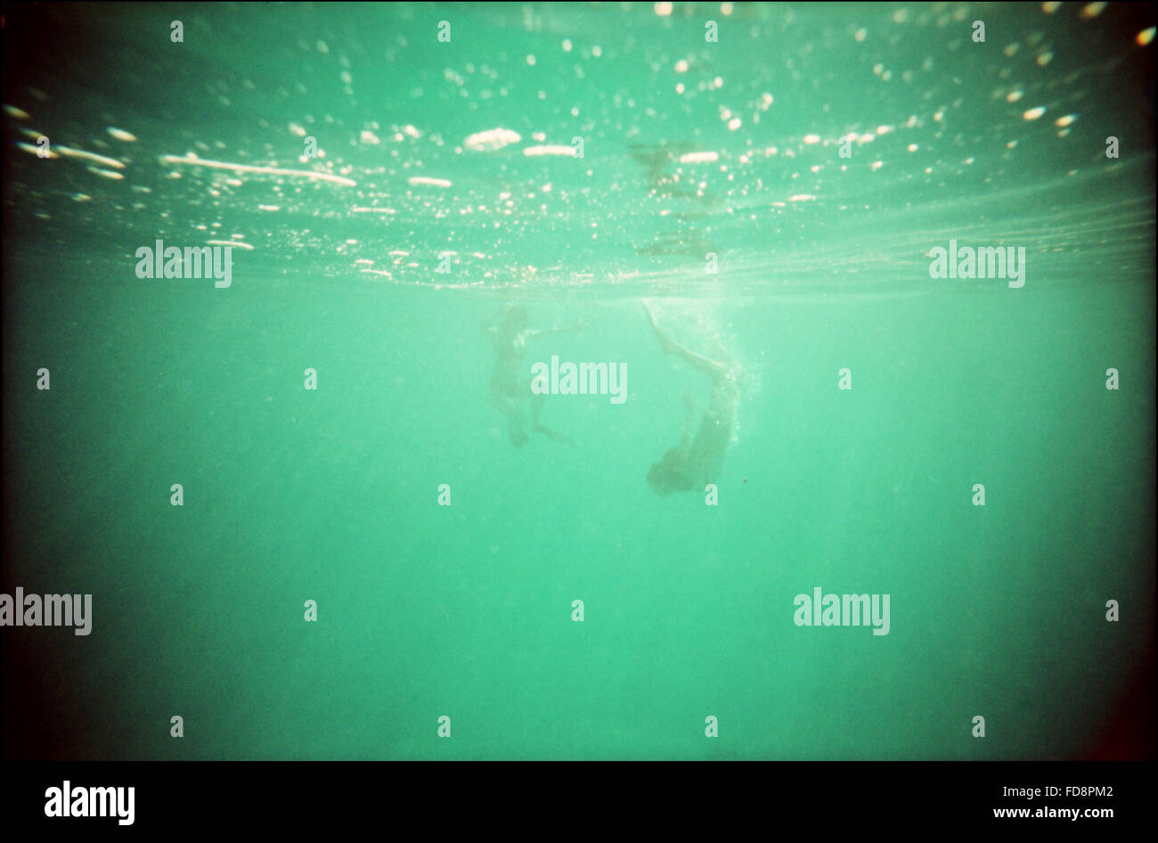 Underwater Scene Of Women Diving In Sea Stock Photo - Alamy
