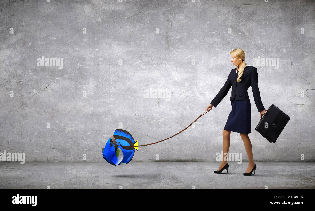 Young businesswoman and big exotic fish. Success in business Stock ...
