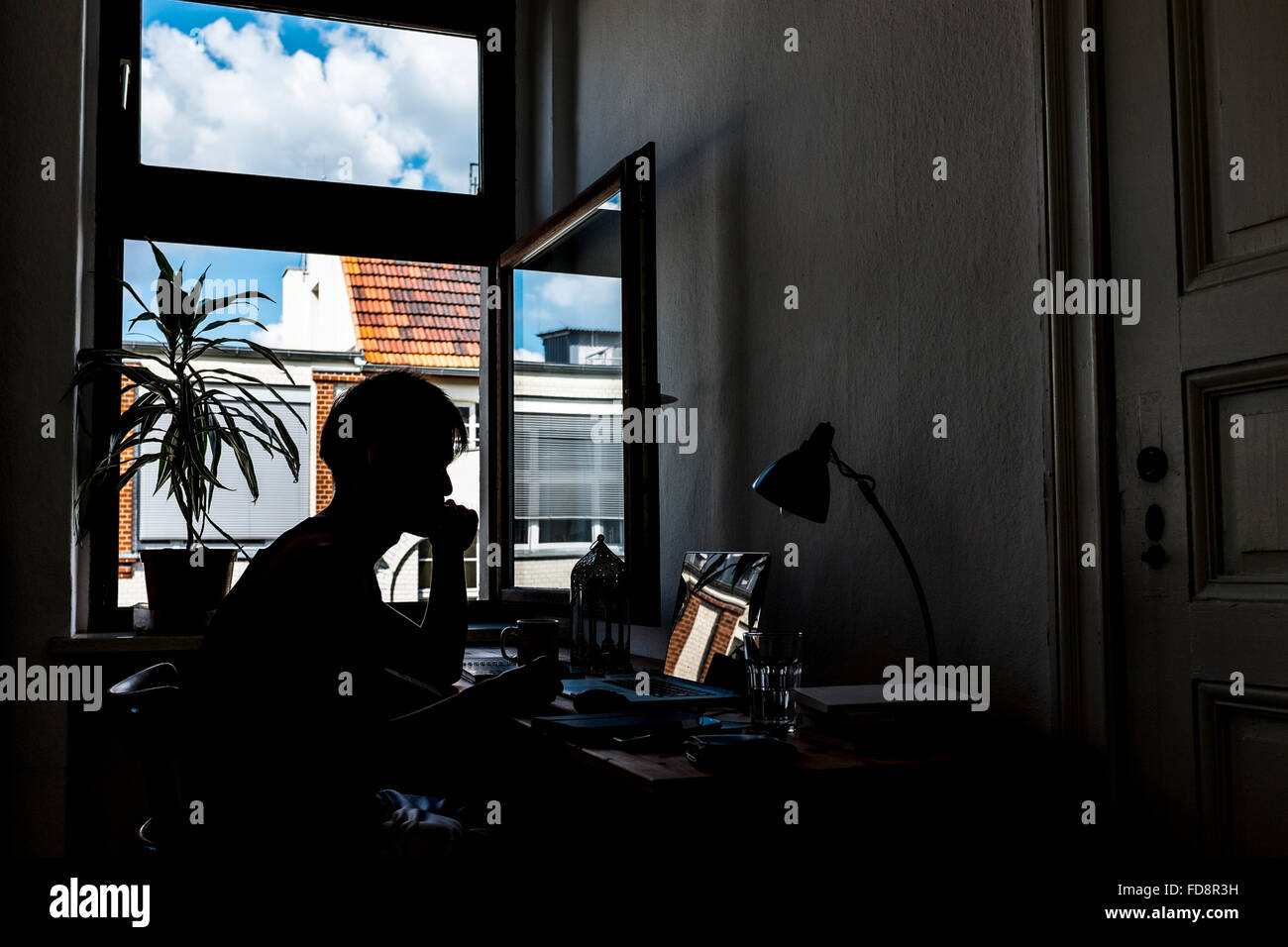 Silhouette man desk hi-res stock photography and images - Alamy