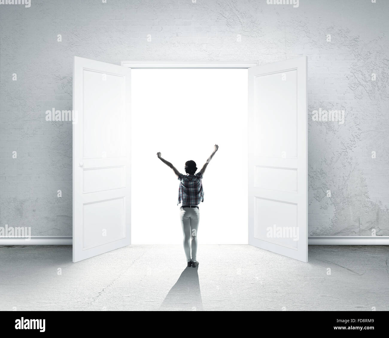 Rear view of woman with hands up entering opened door Stock Photo - Alamy
