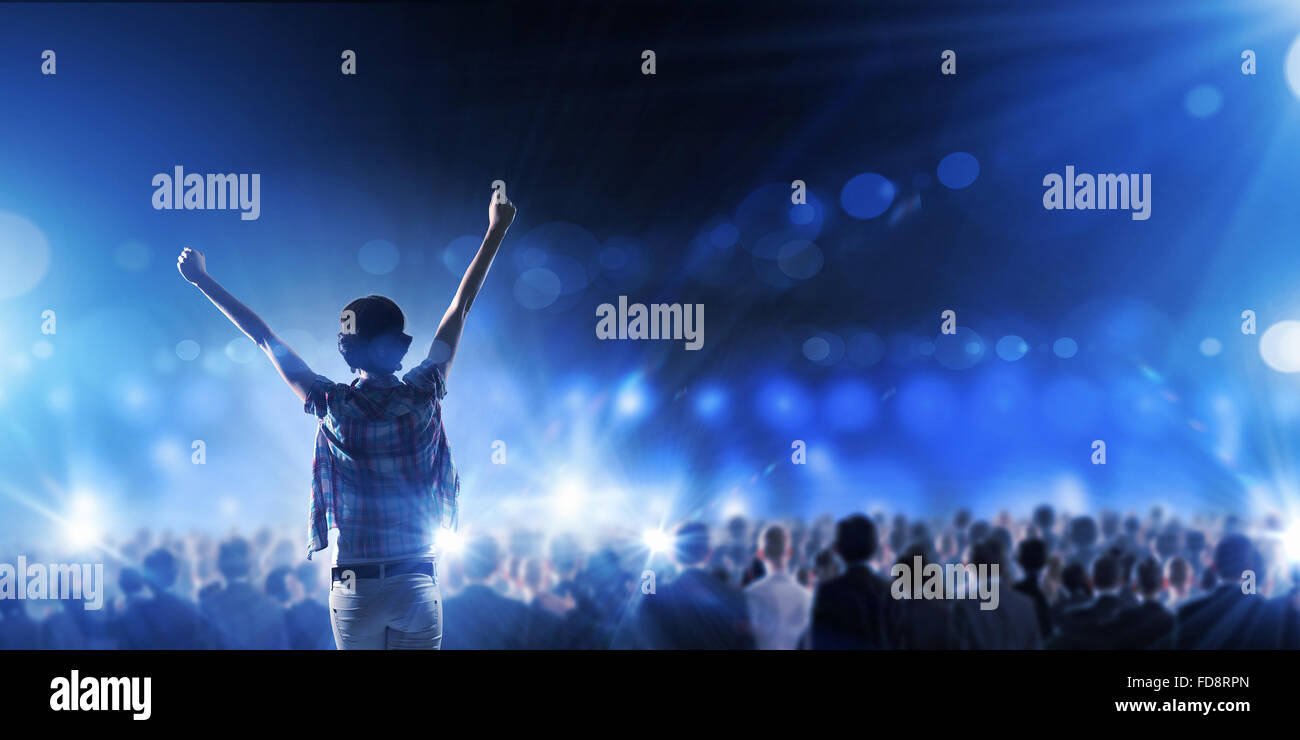 Back view of girl standing in stage lights Stock Photo - Alamy
