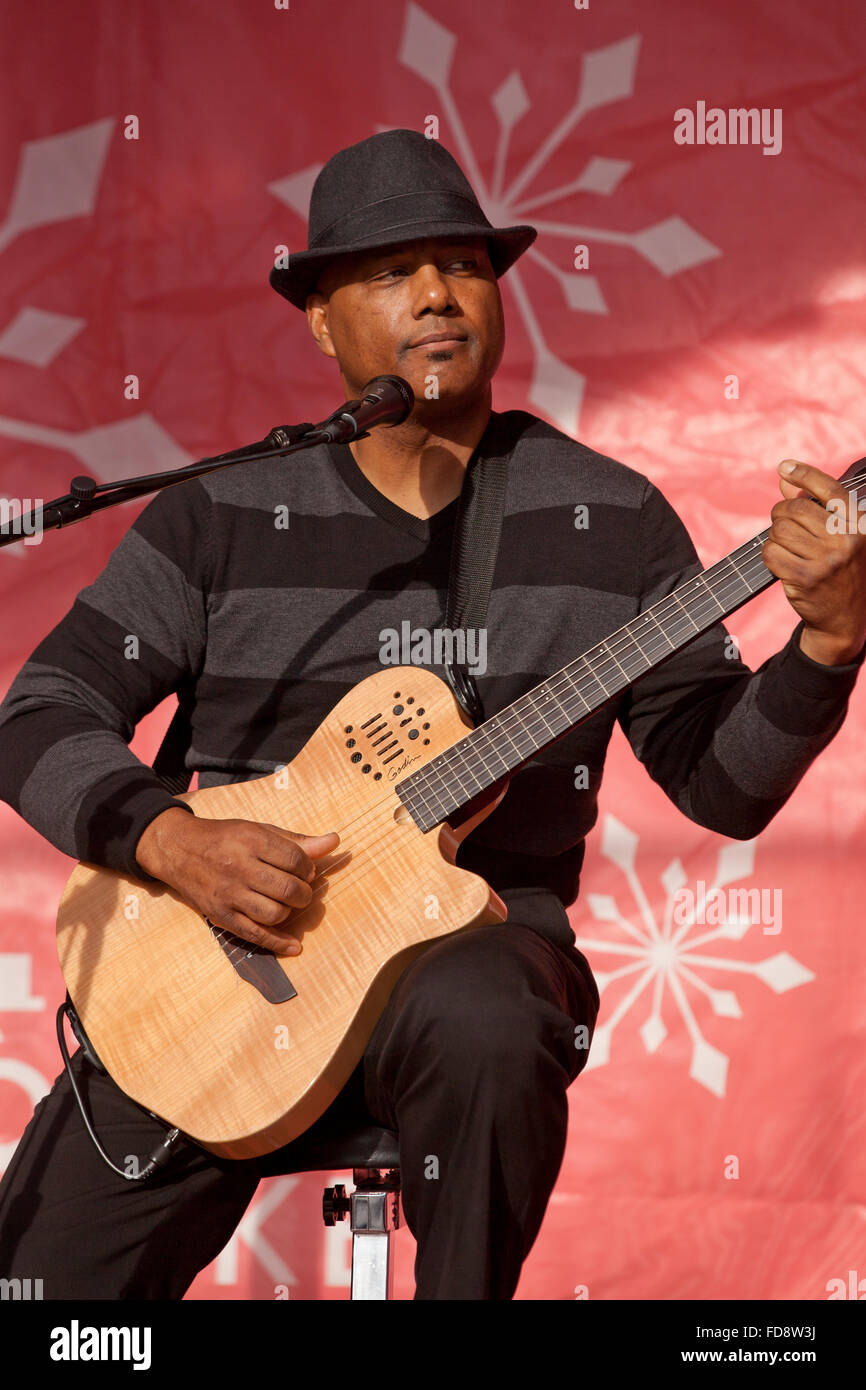 Singer, guitar player performing on stage - USA Stock Photo - Alamy