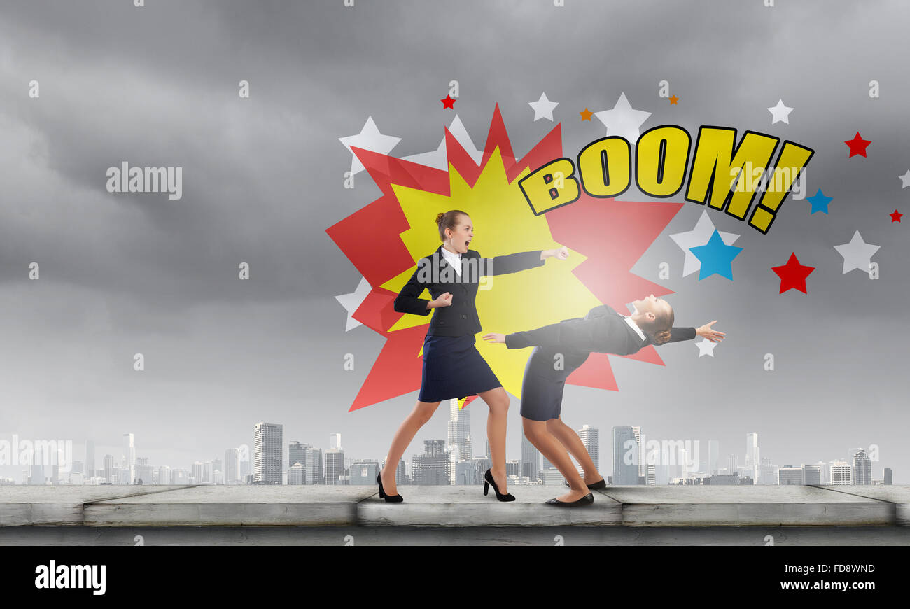 Two businesspeople in anger fighting with each other Stock Photo - Alamy