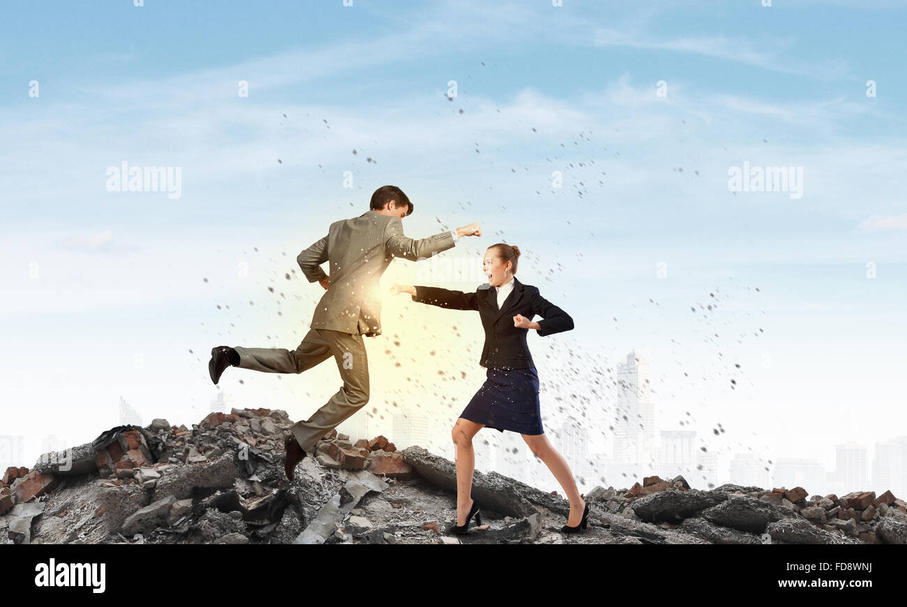 Two businesspeople in anger fighting with each other Stock Photo - Alamy