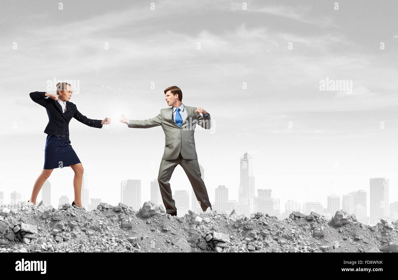 Two businesspeople in anger fighting with each other Stock Photo - Alamy