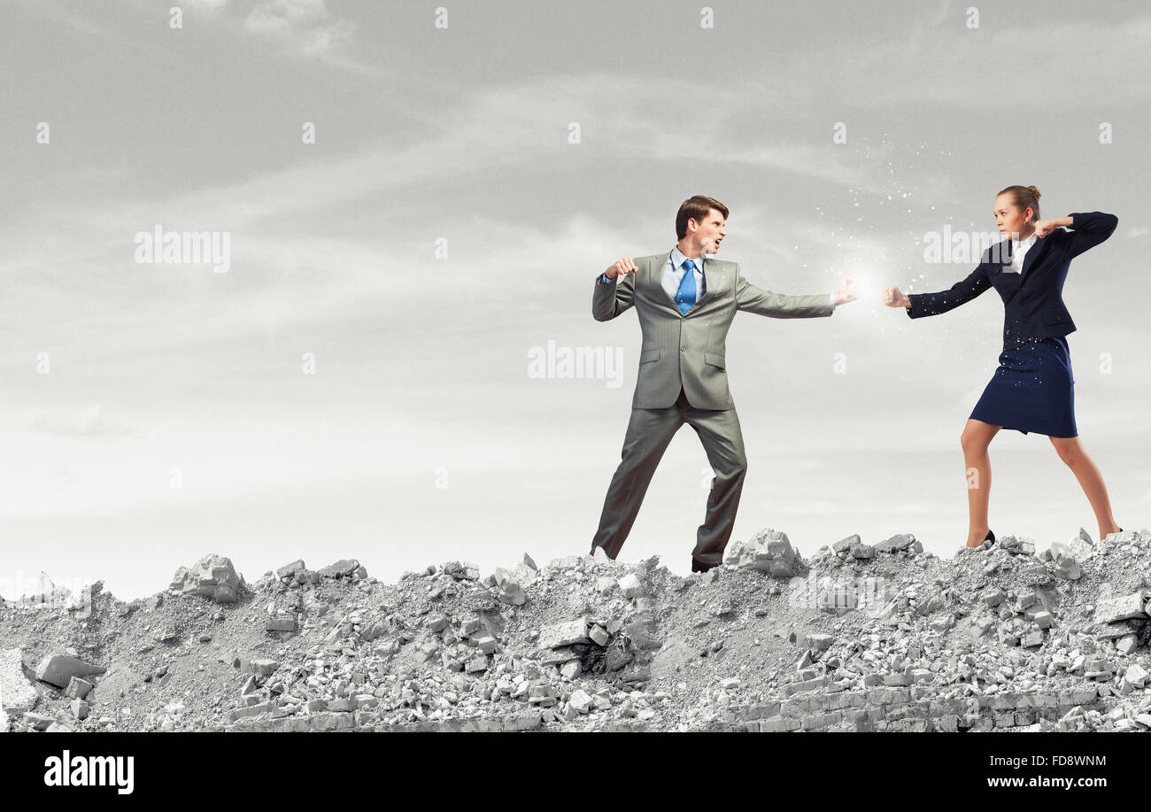 Two businesspeople in anger fighting with each other Stock Photo - Alamy