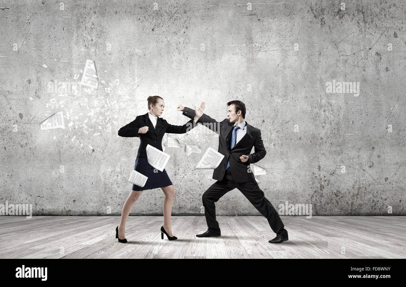 Two businesspeople in anger fighting with each other Stock Photo - Alamy