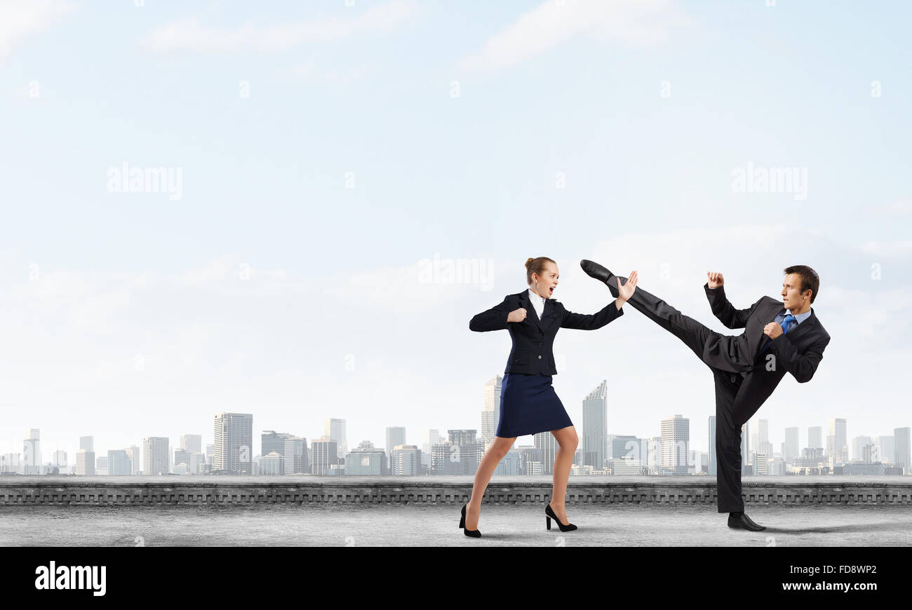 Two businesspeople in anger fighting with each other Stock Photo - Alamy