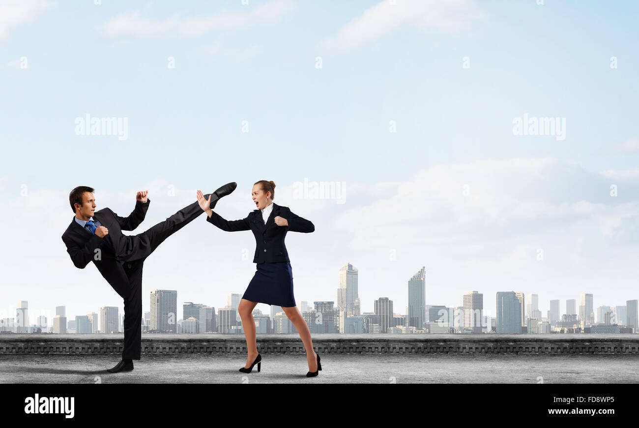 Two businesspeople in anger fighting with each other Stock Photo - Alamy