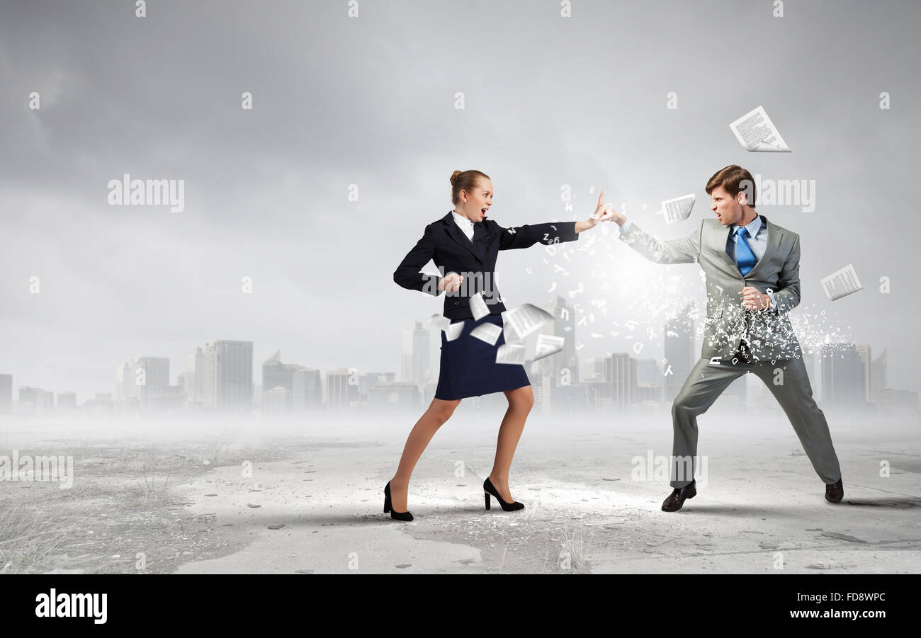 Two businesspeople in anger fighting with each other Stock Photo - Alamy