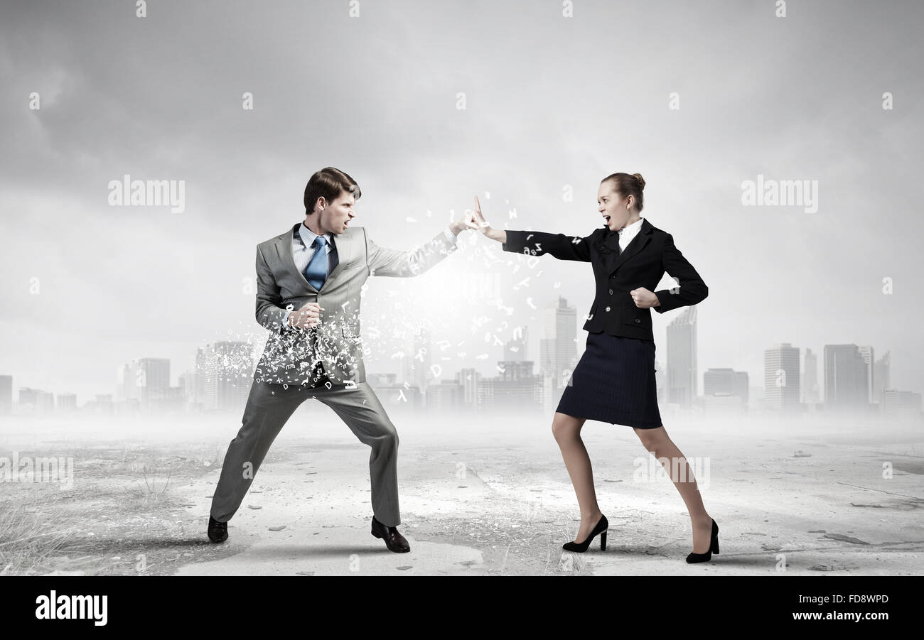 Two businesspeople in anger fighting with each other Stock Photo - Alamy
