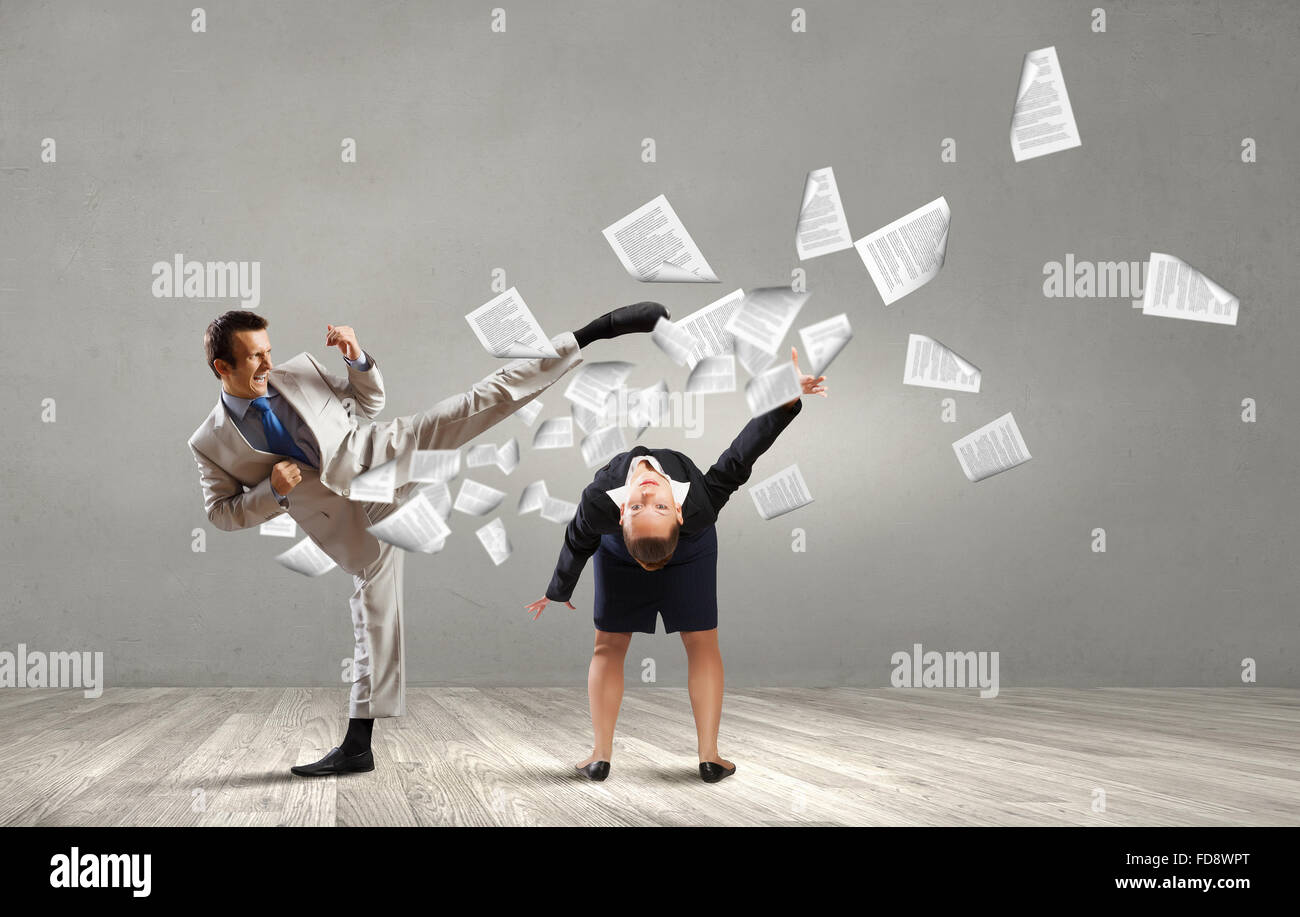 Two businesspeople in anger fighting with each other Stock Photo - Alamy