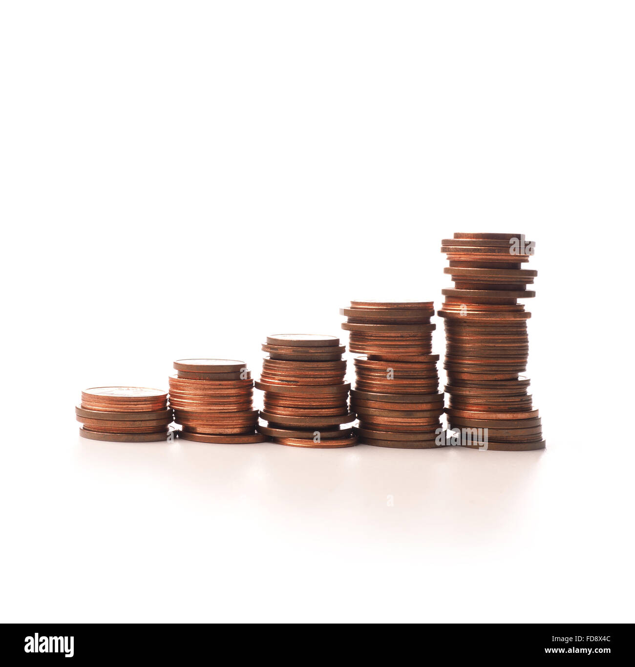 Stacked coins on a white background, financial concept Stock Photo - Alamy