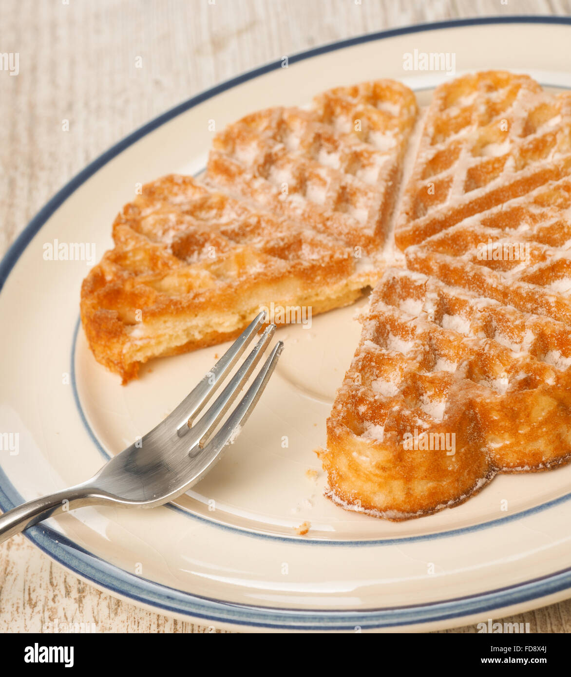 Sweet waffle on a rustic plate in a kitchen Stock Photo - Alamy