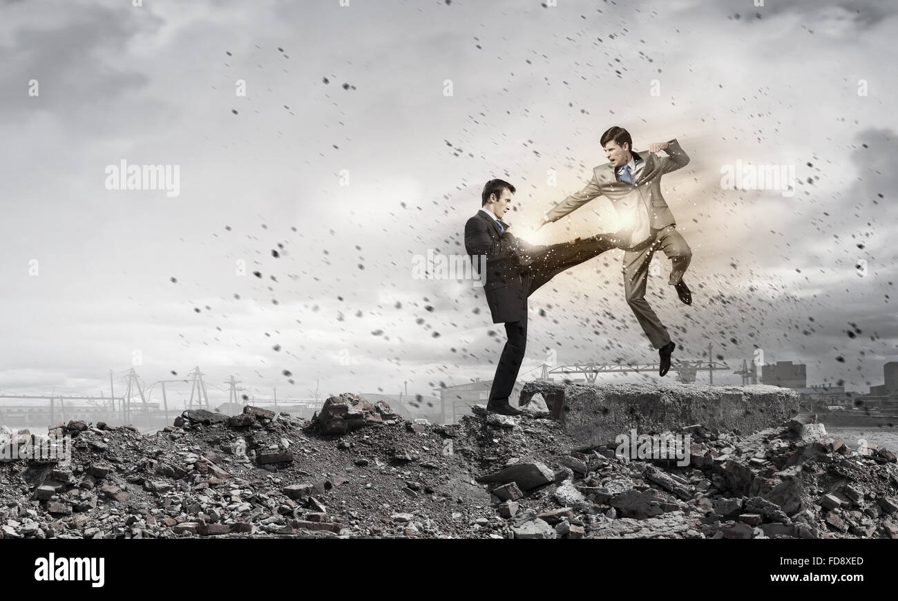 Two businesspeople in anger fighting with each other Stock Photo - Alamy