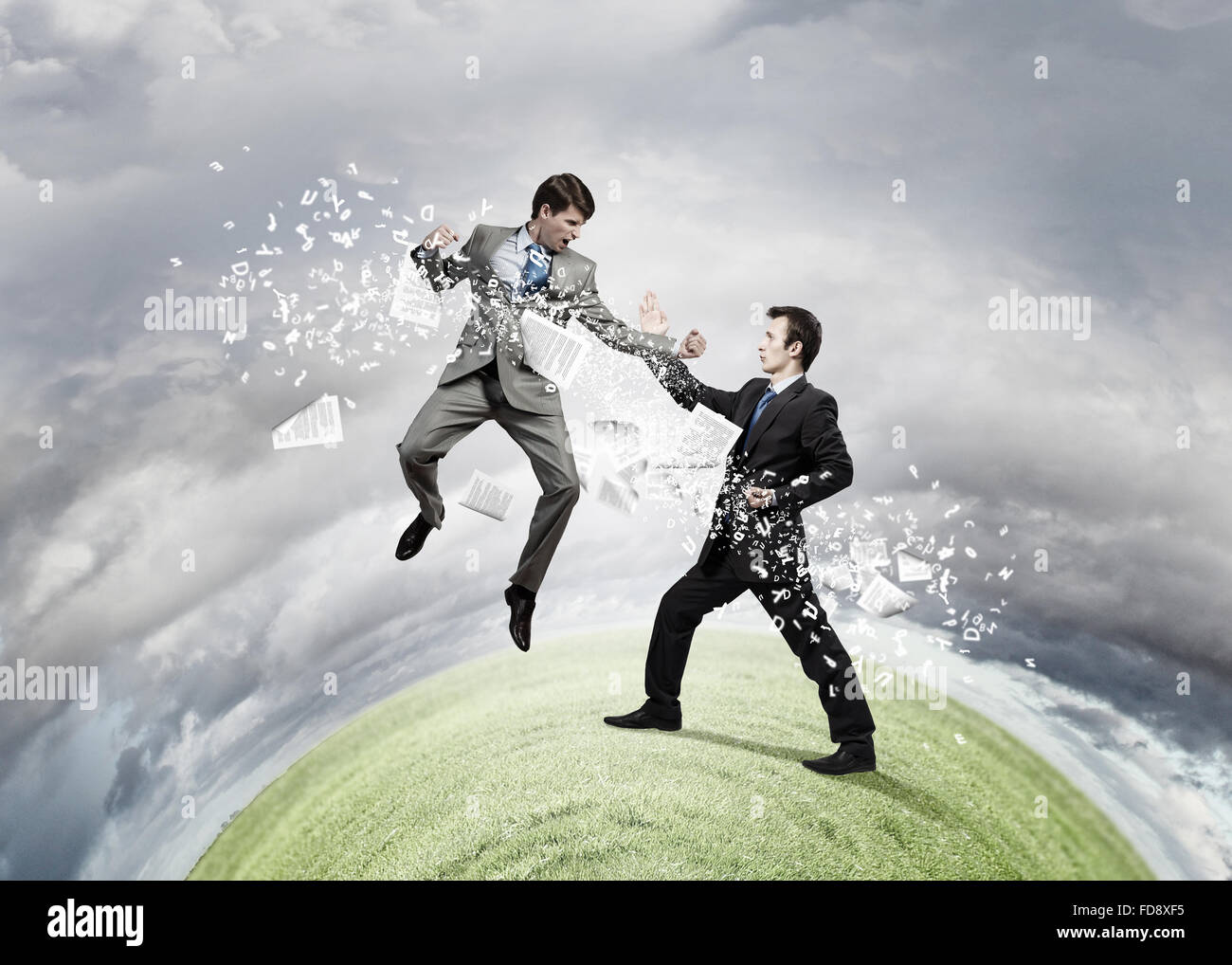 Two businesspeople in anger fighting with each other Stock Photo - Alamy
