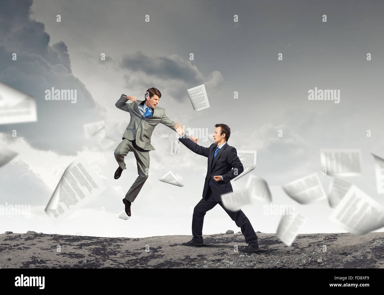 Two businesspeople in anger fighting with each other Stock Photo - Alamy