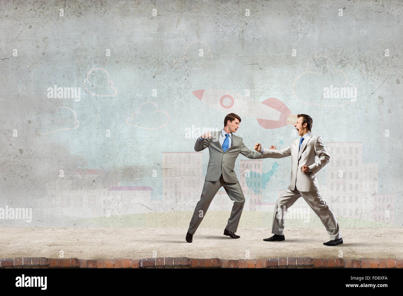 Two businesspeople in anger fighting with each other Stock Photo - Alamy