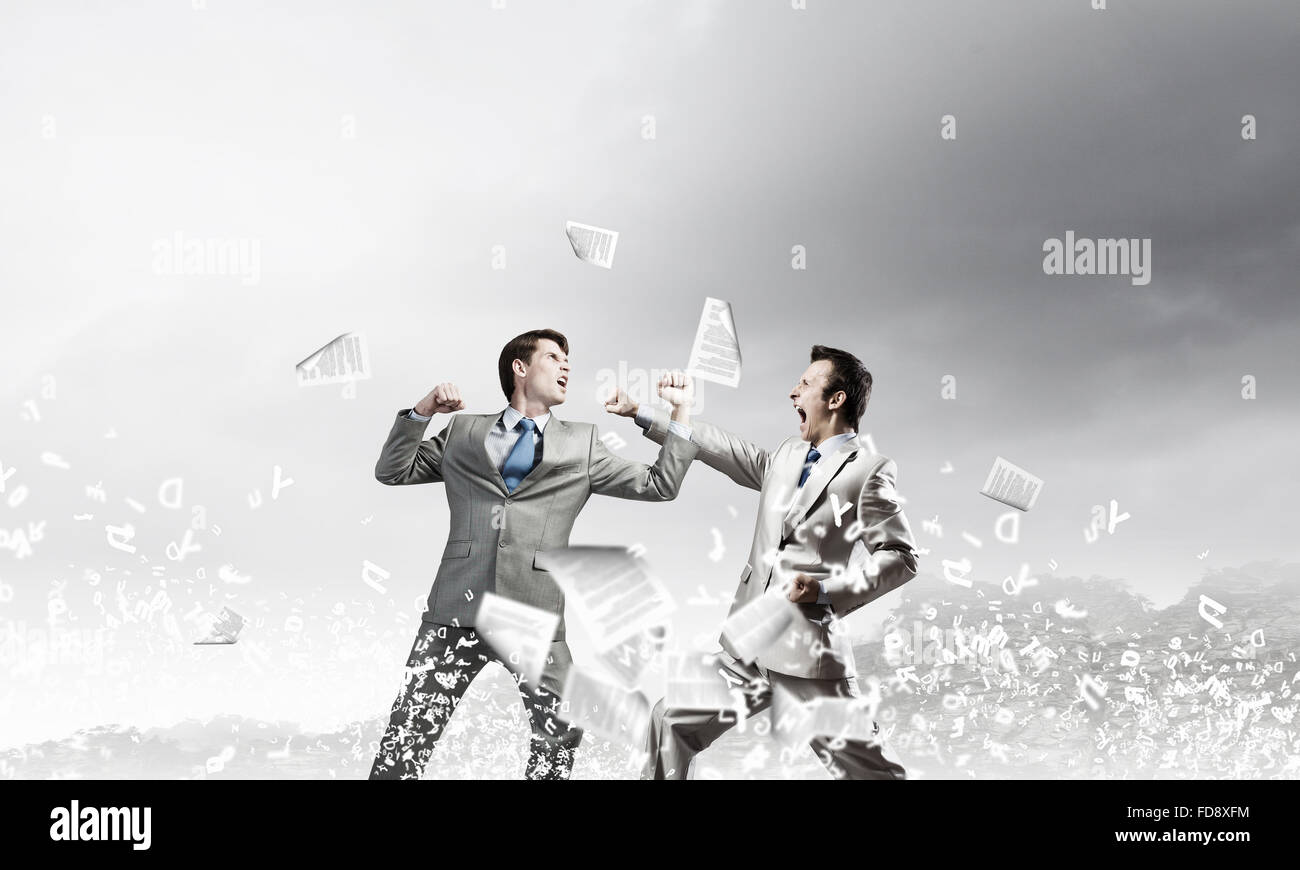Two businesspeople in anger fighting with each other Stock Photo - Alamy