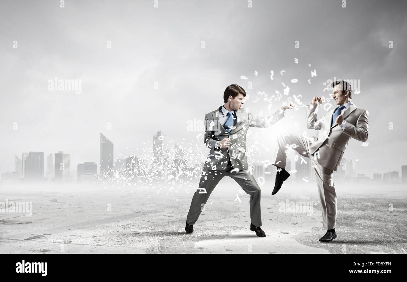 Two businesspeople in anger fighting with each other Stock Photo - Alamy