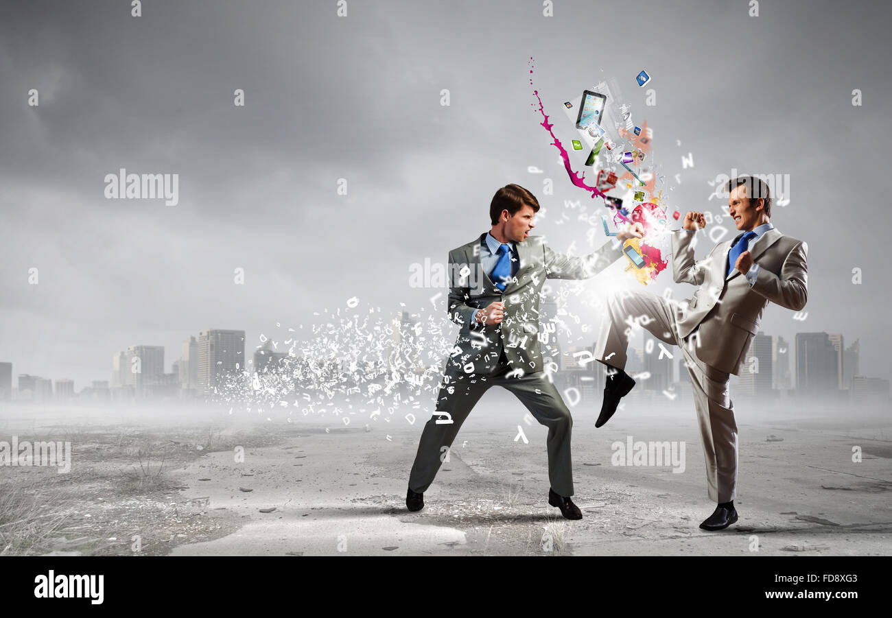 Two businesspeople in anger fighting with each other Stock Photo - Alamy