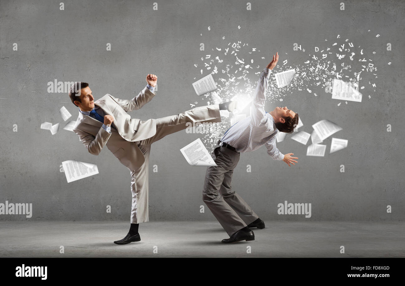 Two businesspeople in anger fighting with each other Stock Photo - Alamy