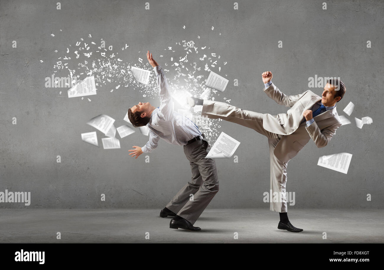 Two businesspeople in anger fighting with each other Stock Photo - Alamy