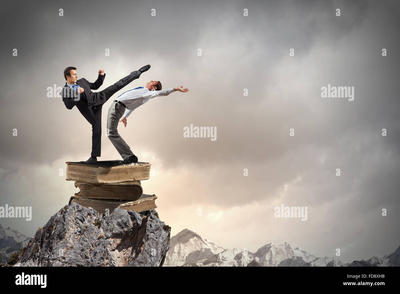 Two businesspeople in anger fighting with each other Stock Photo - Alamy