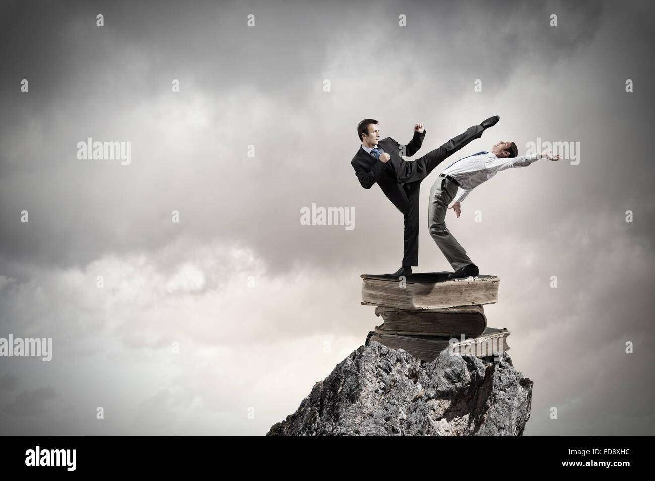 Two businesspeople in anger fighting with each other Stock Photo - Alamy