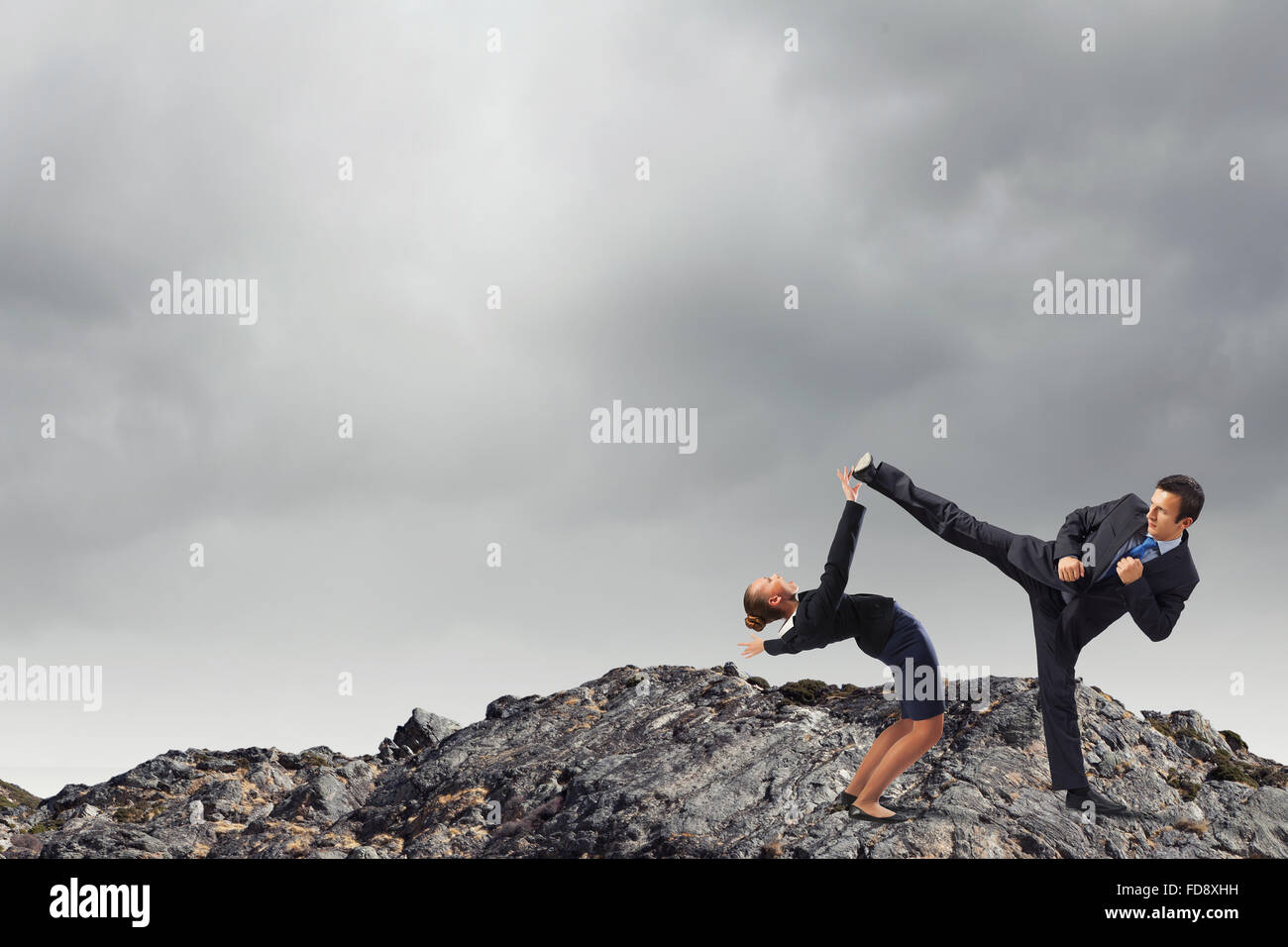 Two businesspeople in anger fighting with each other Stock Photo - Alamy