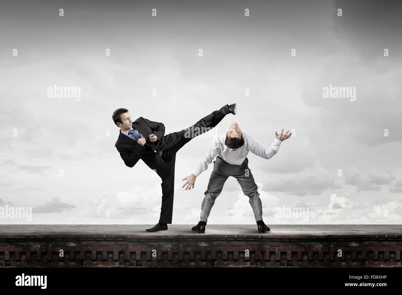 Two businesspeople in anger fighting with each other Stock Photo - Alamy