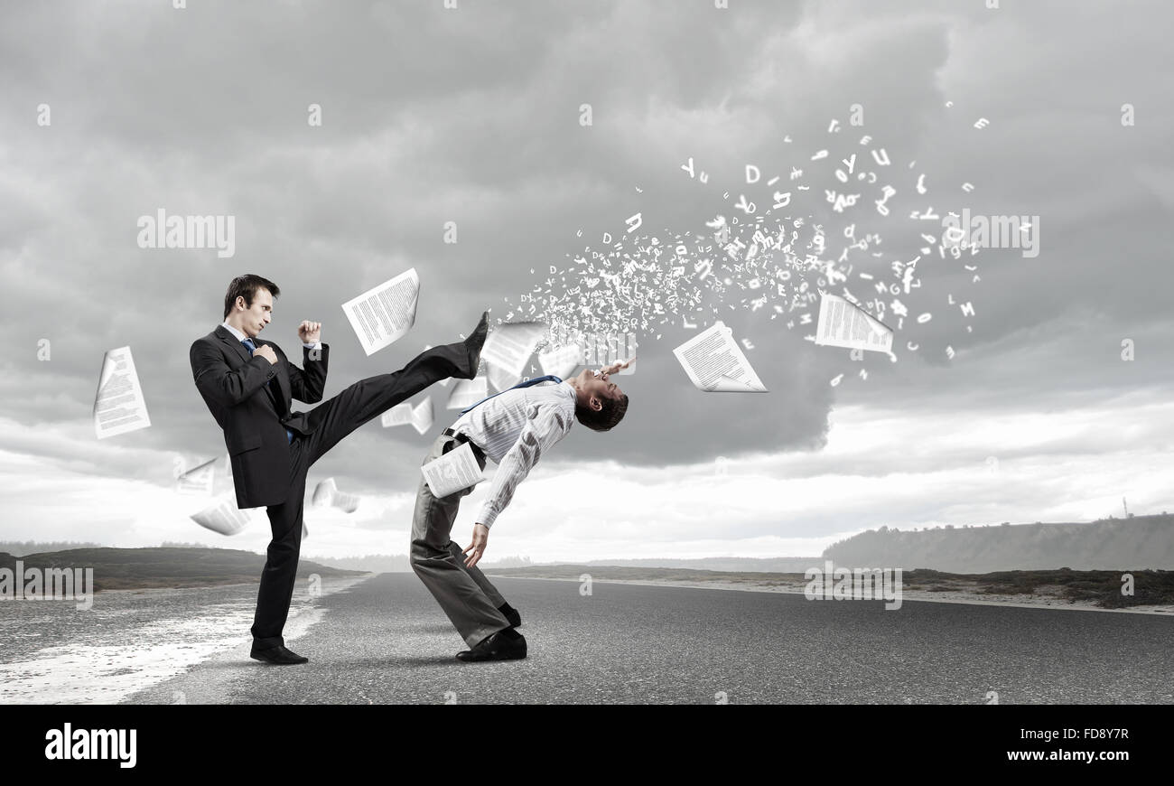 Two businesspeople in anger fighting with each other Stock Photo - Alamy